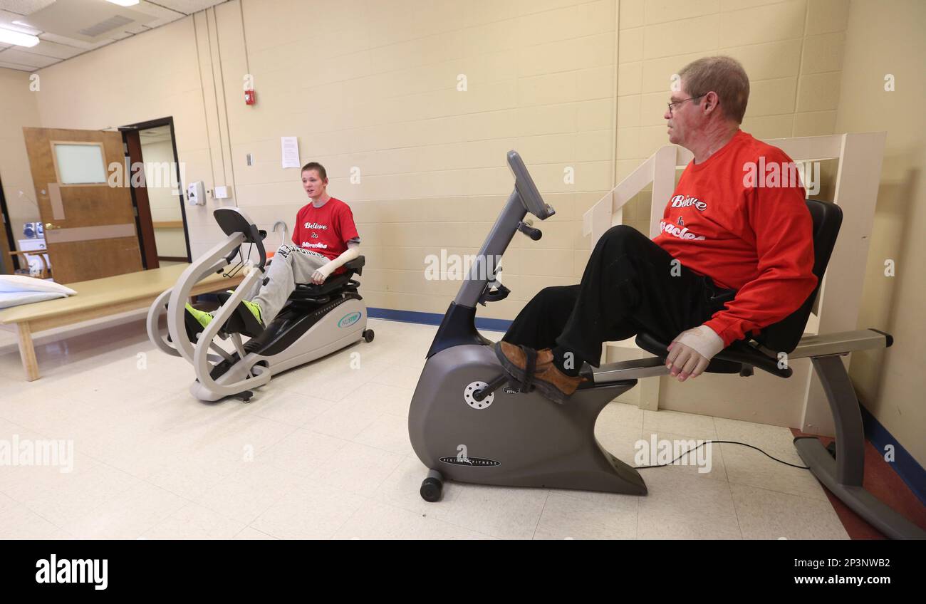 In this Dec. 16, 2014 photo, Alex Kreger, left, and his father Scott ...