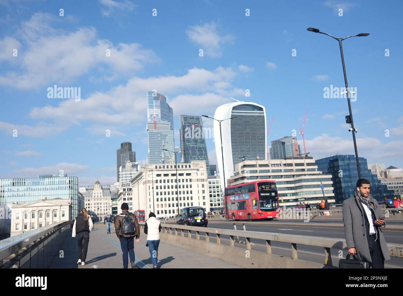 London Bridge over the River Thames in central London on a sunny early ...