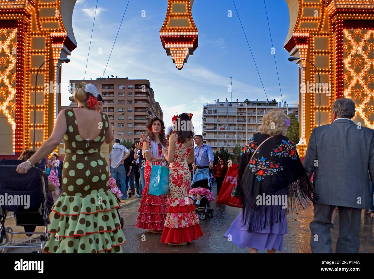 Feria de Abril (The April Fair). "El Real". People in main gate ...