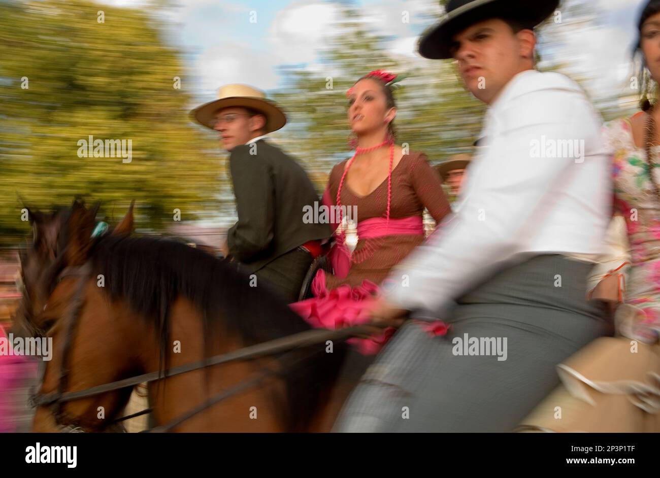 Feria de Abril (The April Fair). "El Real". Women wearing traditional ...