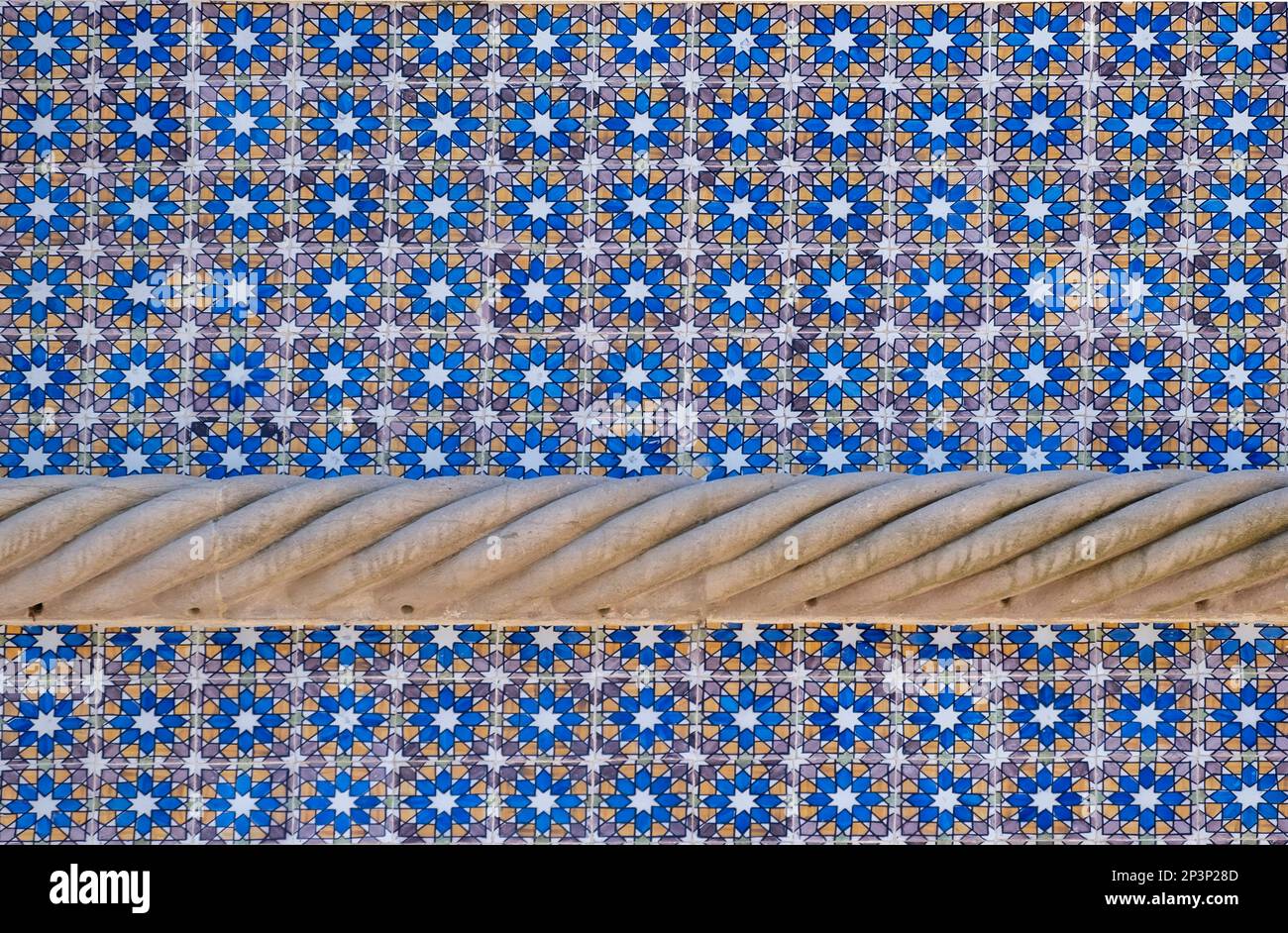 detail of tiles decorated with geometric shapes, and a stone ornament ...