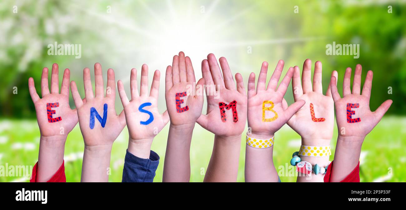 Children Hands Building Word Ensemble, Grass Meadow Stock Photo - Alamy