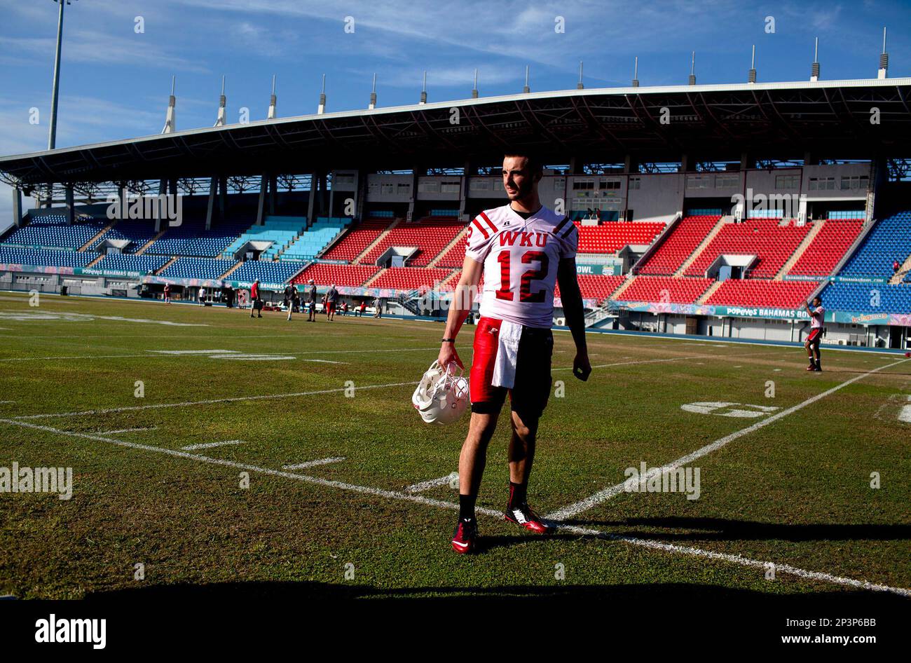 Western Kentucky quarterback Brandon Doughty walks along the field ...