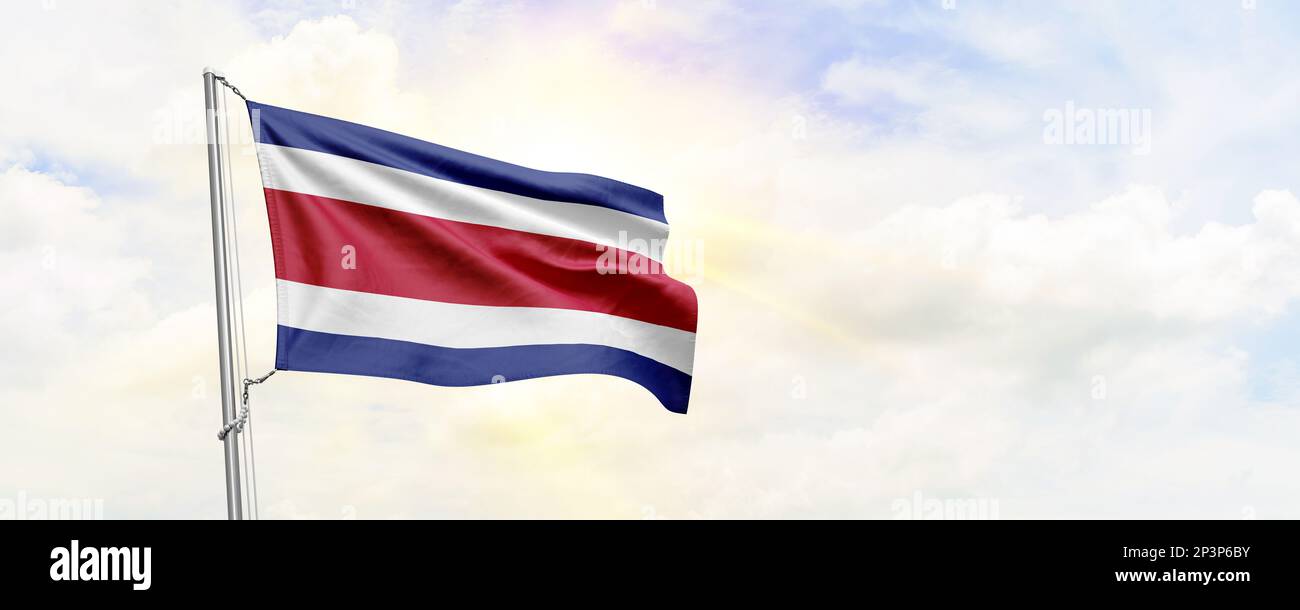 Costa Rica flag waving on sky background. 3D Rendering Stock Photo - Alamy