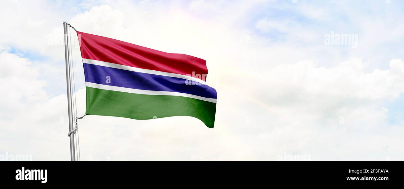 Gambia flag waving on sky background. 3D Rendering Stock Photo - Alamy