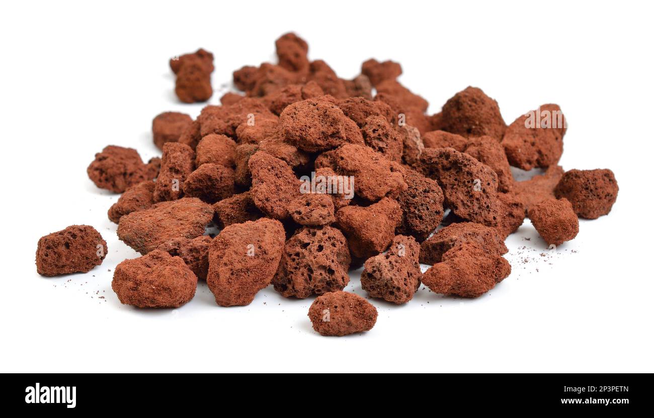 Porous brown volcanic rock isolated on white background. Lava stone ...