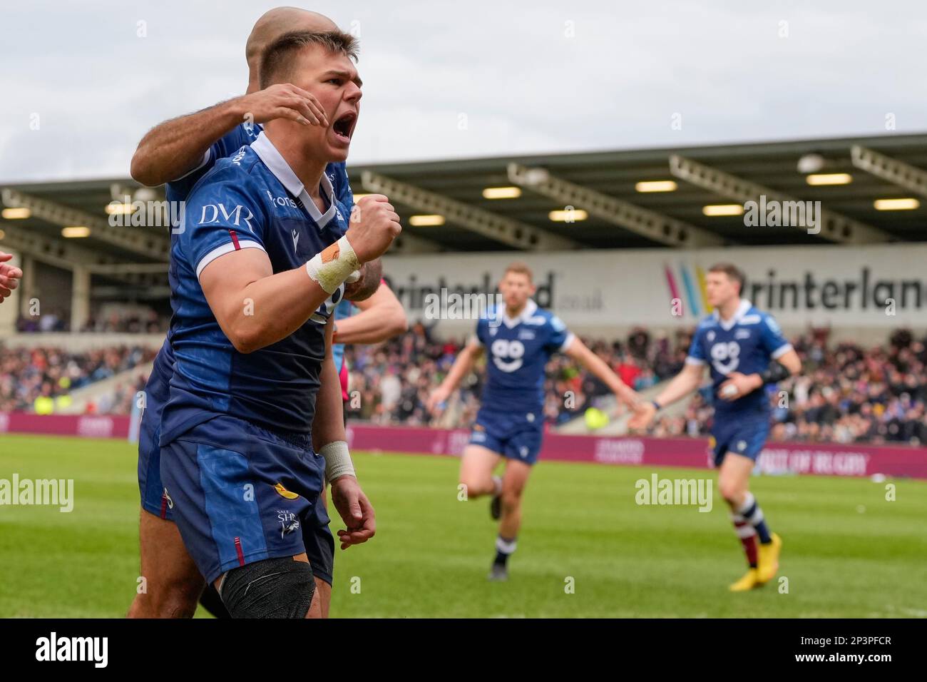 Joe Carpenter #15 of Sale Sharks celebrates his try during the ...