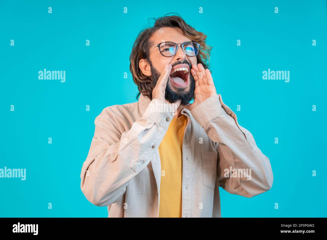 Man shouting loud calling attention with hands like megaphone isolated ...