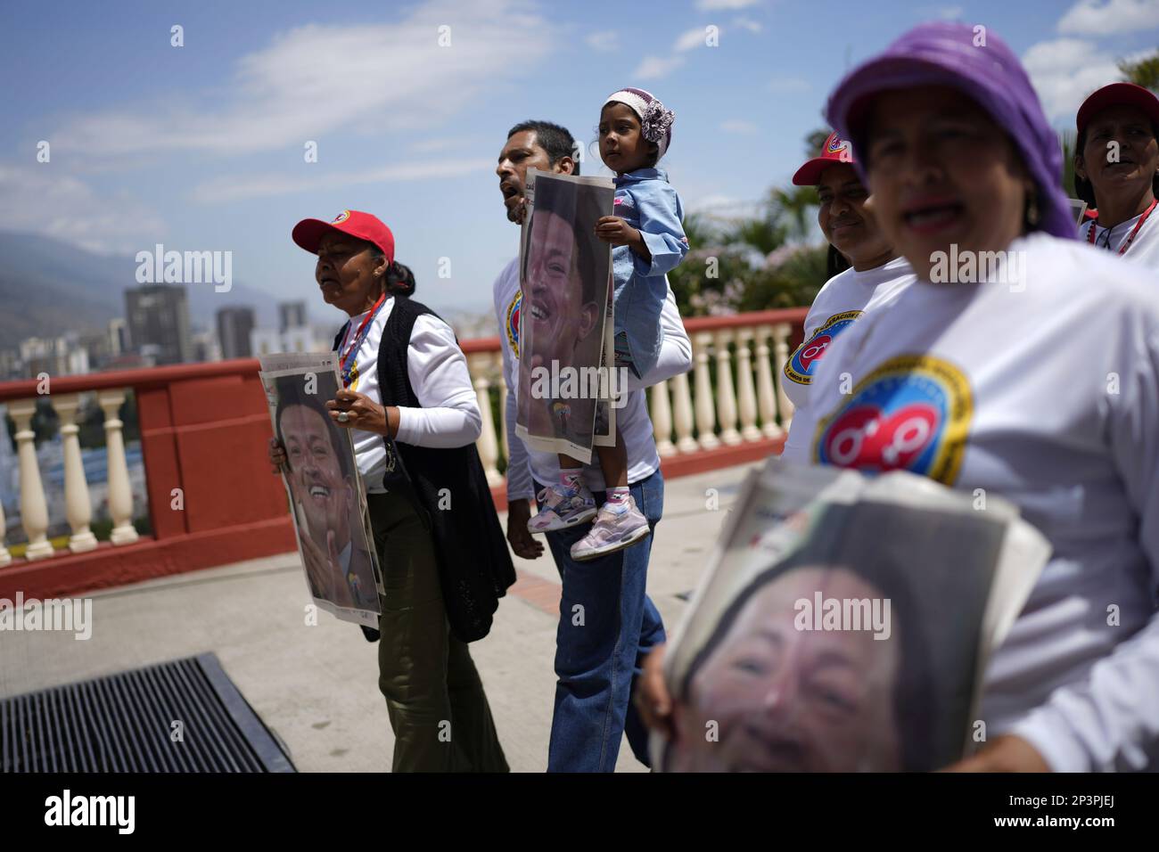Visitors holding posters with the image of late Venezuelan President ...