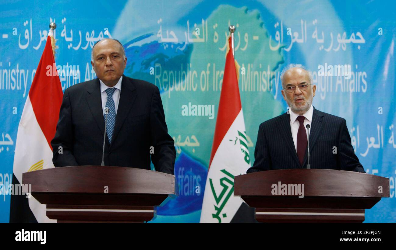 Iraqi Foreign Minister Ibrahim al-Jaafari, right, speaks during a news ...