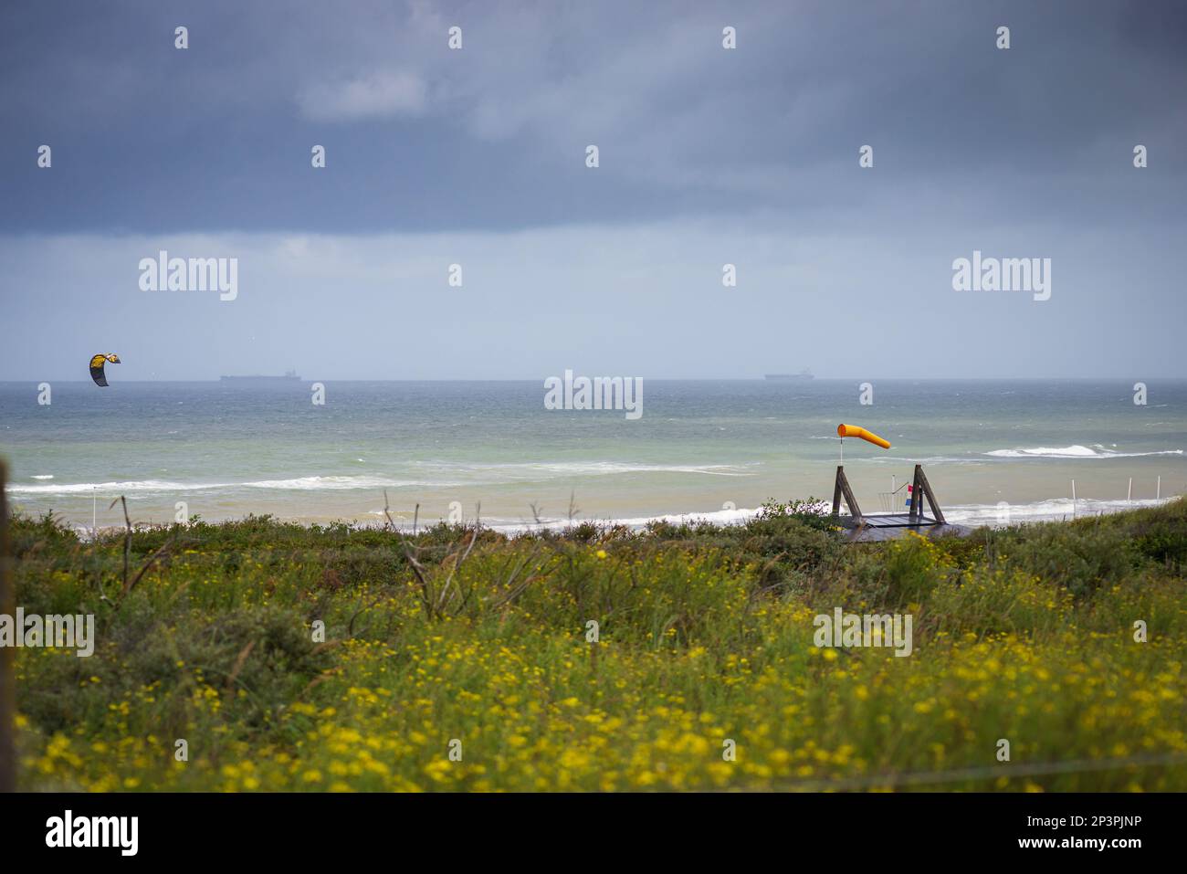 Windsock and Netherlands national flag on the Scheveningen beach ...