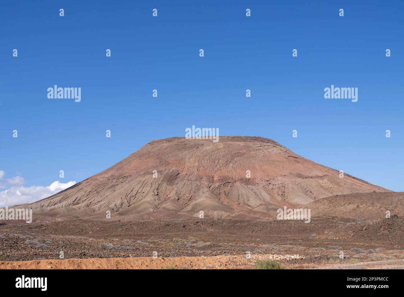 Impressive Red Mountail (Montana Roja), surrounded by desert. Bright ...