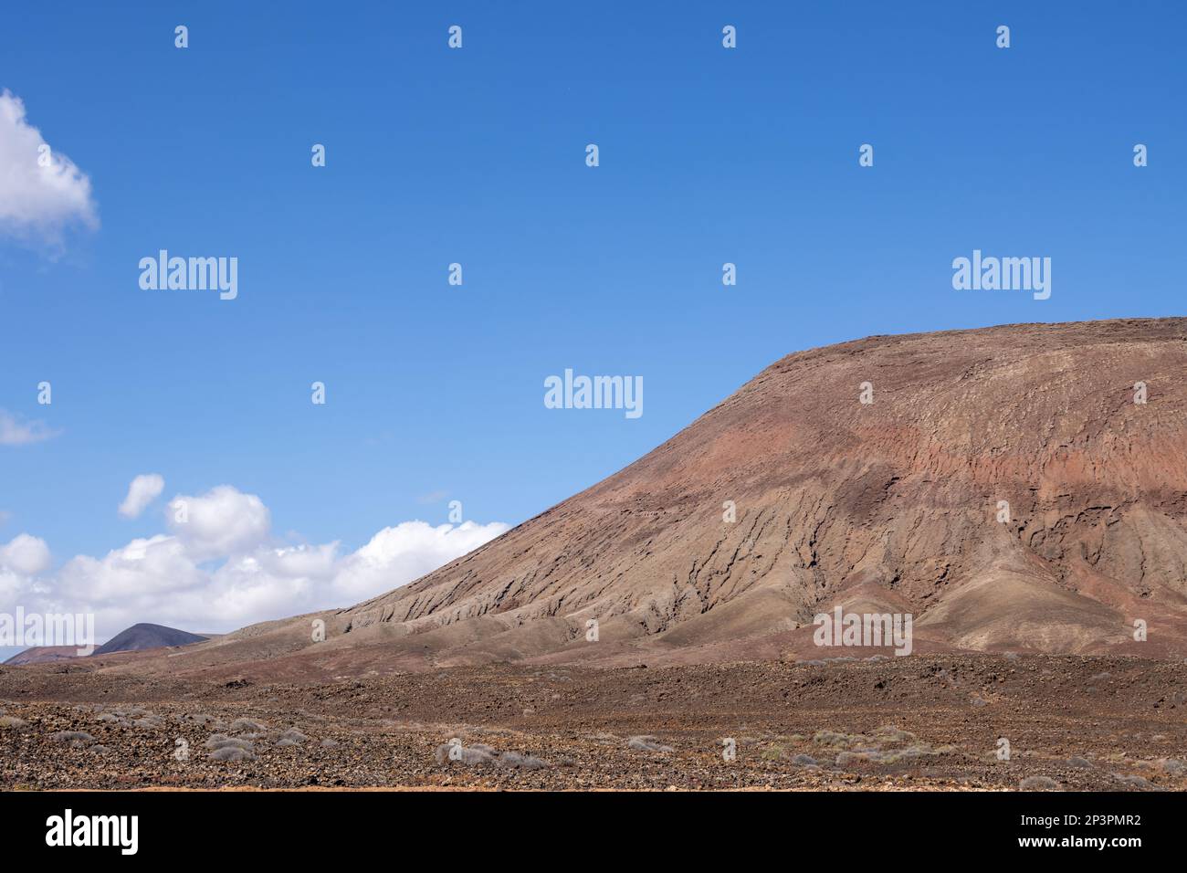 Impressive Red Mountail (Montana Roja), surrounded by desert. Bright ...