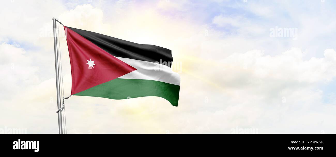 Jordan flag waving on sky background. 3D Rendering Stock Photo - Alamy