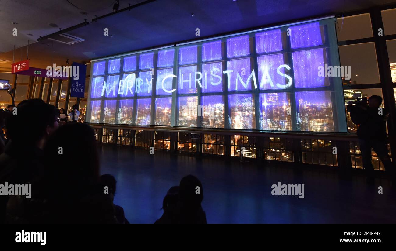 Visitor watch an image reflected on a screen by 3D project mapping ...
