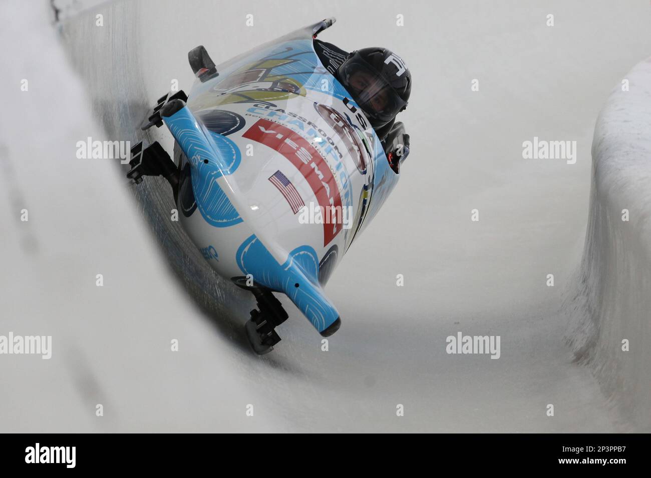 13 December 2014: The USA 3 bobsled driven by Codie Bascue with ...