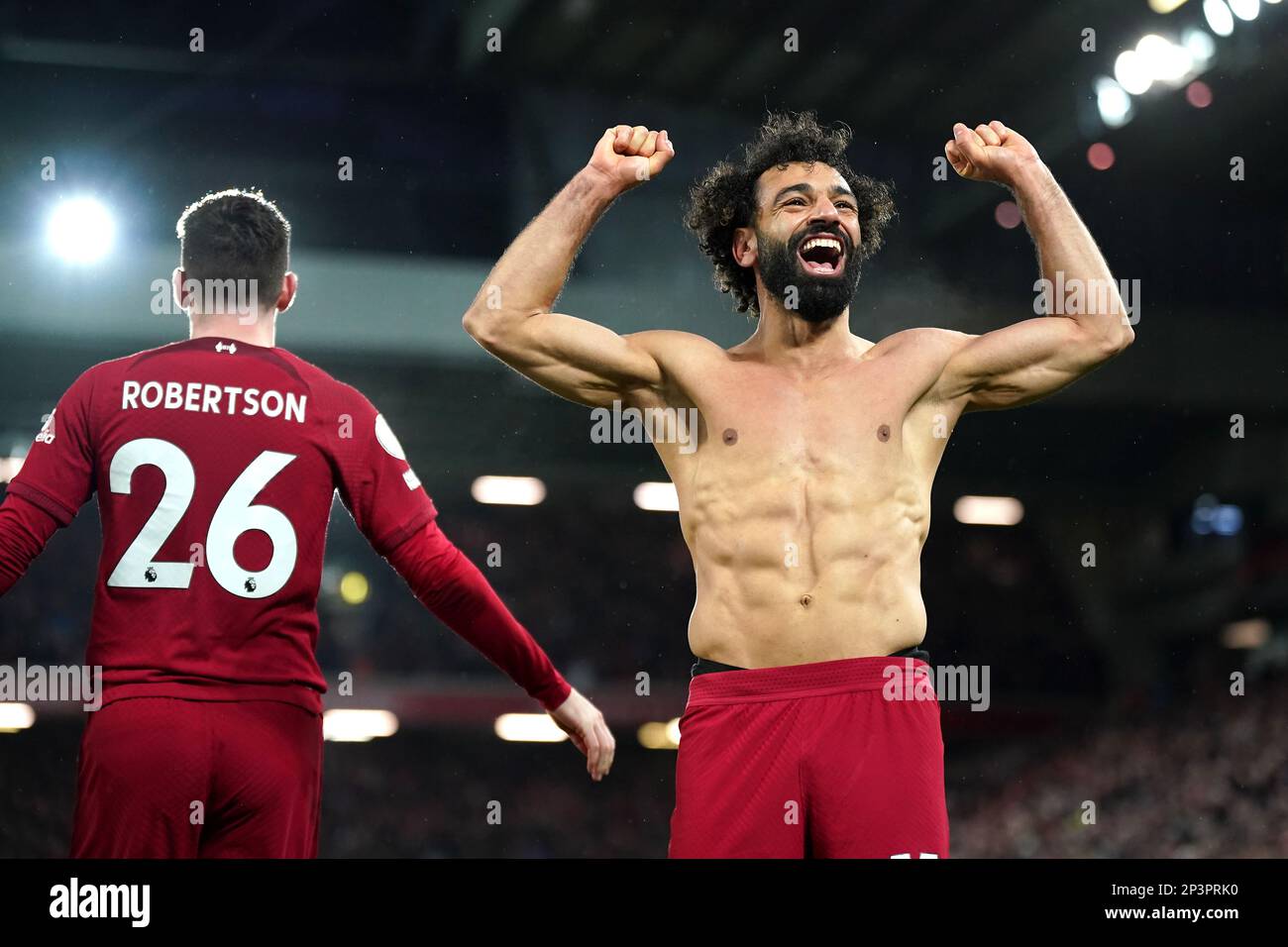 Liverpool's Mohamed Salah (right) celebrates scoring their side's sixth ...