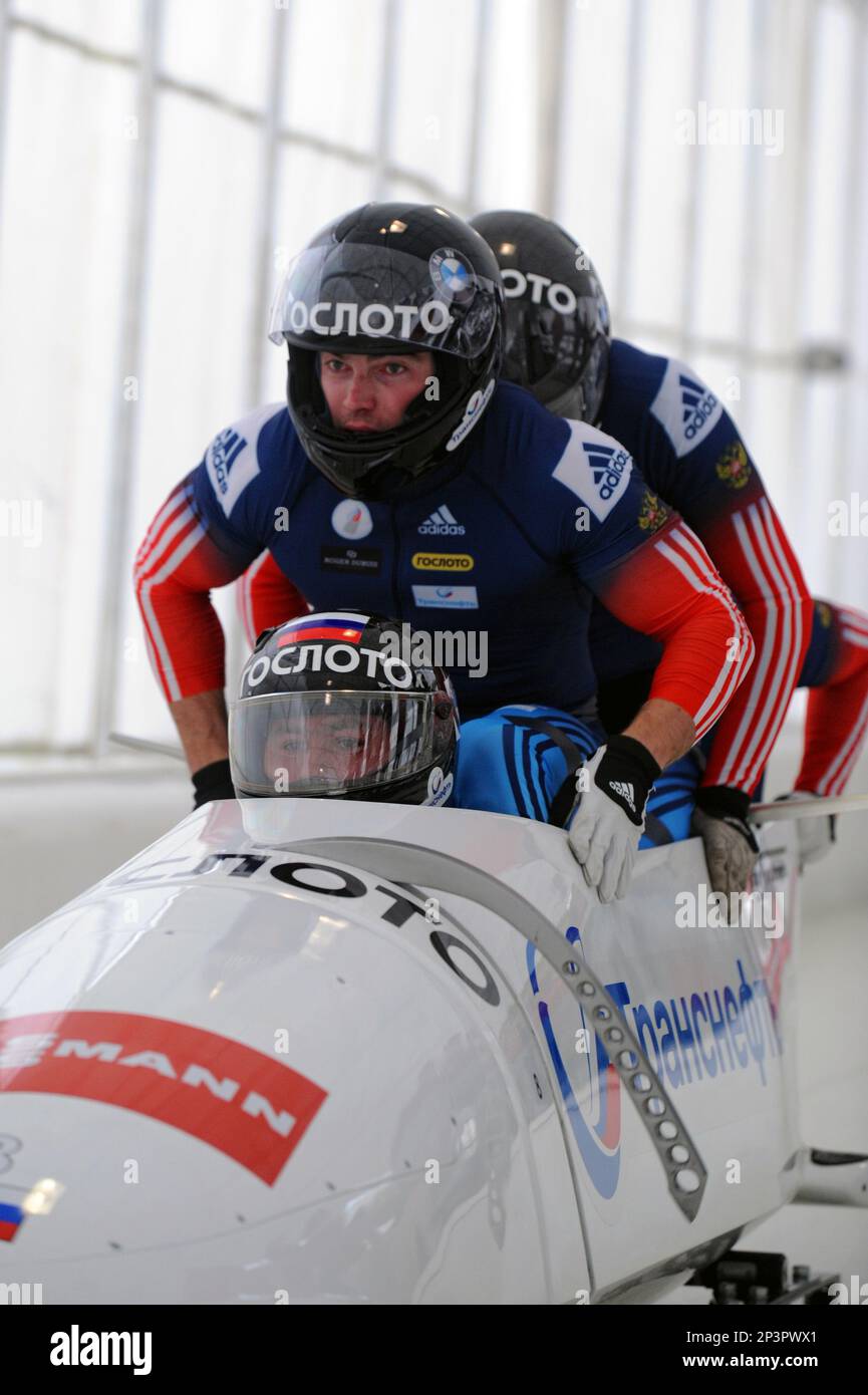 13 December 2014: The Russia 1 bobsled driven by Alexander Kasjanov with sidepushers Maxim ...