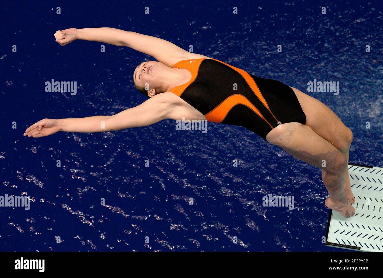 Emily Griffin of Grissom High School dives Friday, Dec. 12, 2014 ...