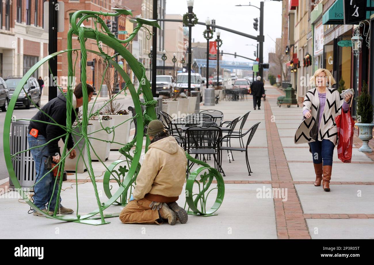 Angie Ebelhar reacts to the, "Vine Bike," as artist Chris Schartung ...