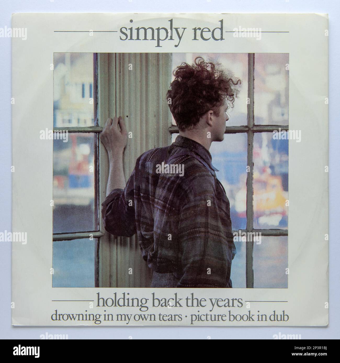 Picture cover of the 12 inch single version of Holding Back the Years by Simply Red, which was ...