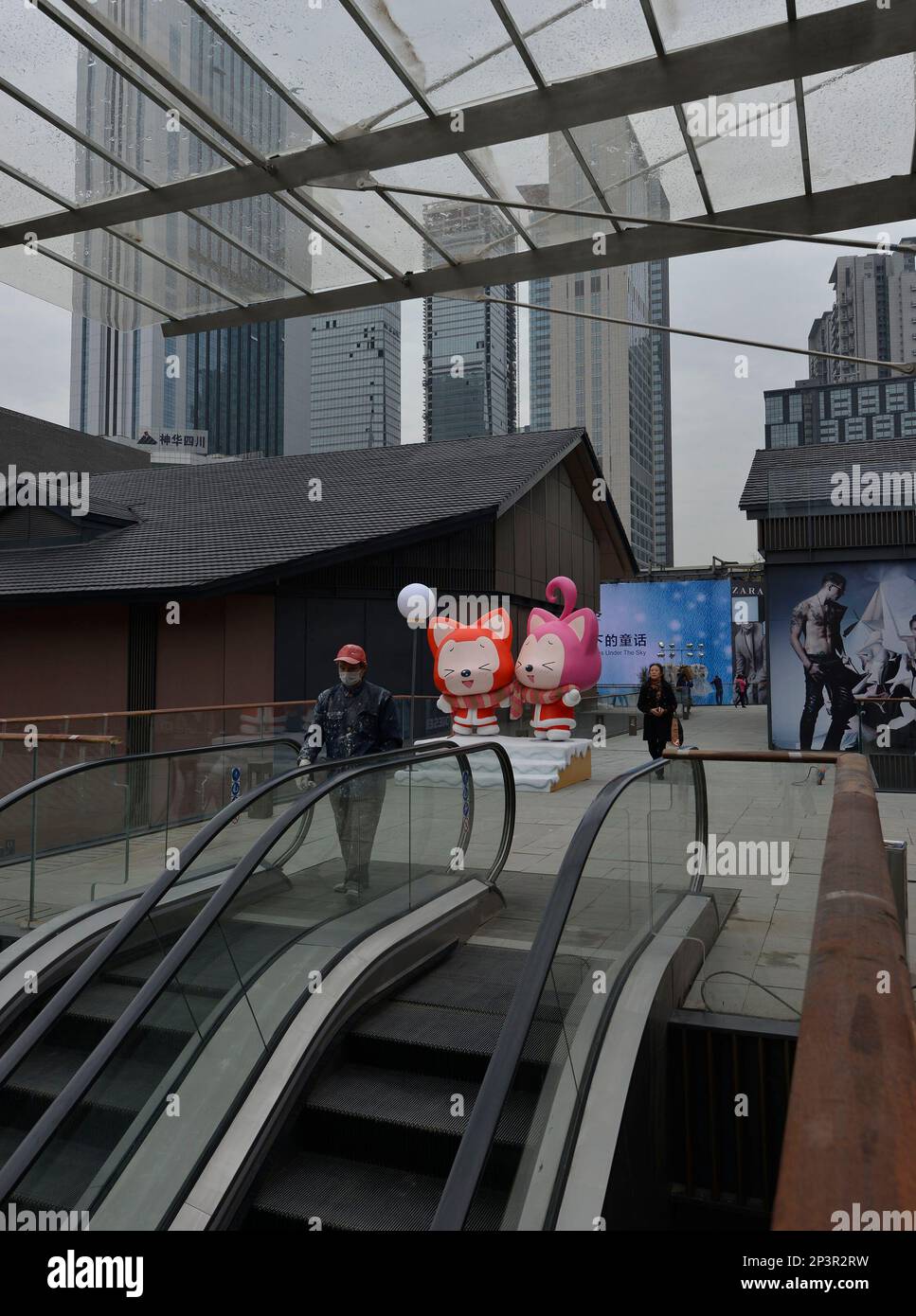 A worker works at the Sino-Ocean Taikoo Li Chengdu shopping center ...