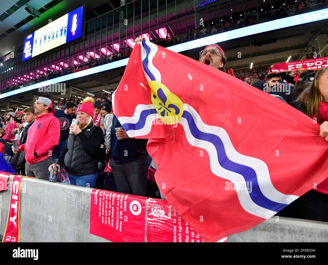 A STLCity fan yells as he waves a city of St. Louis flag. STLCity SC ...