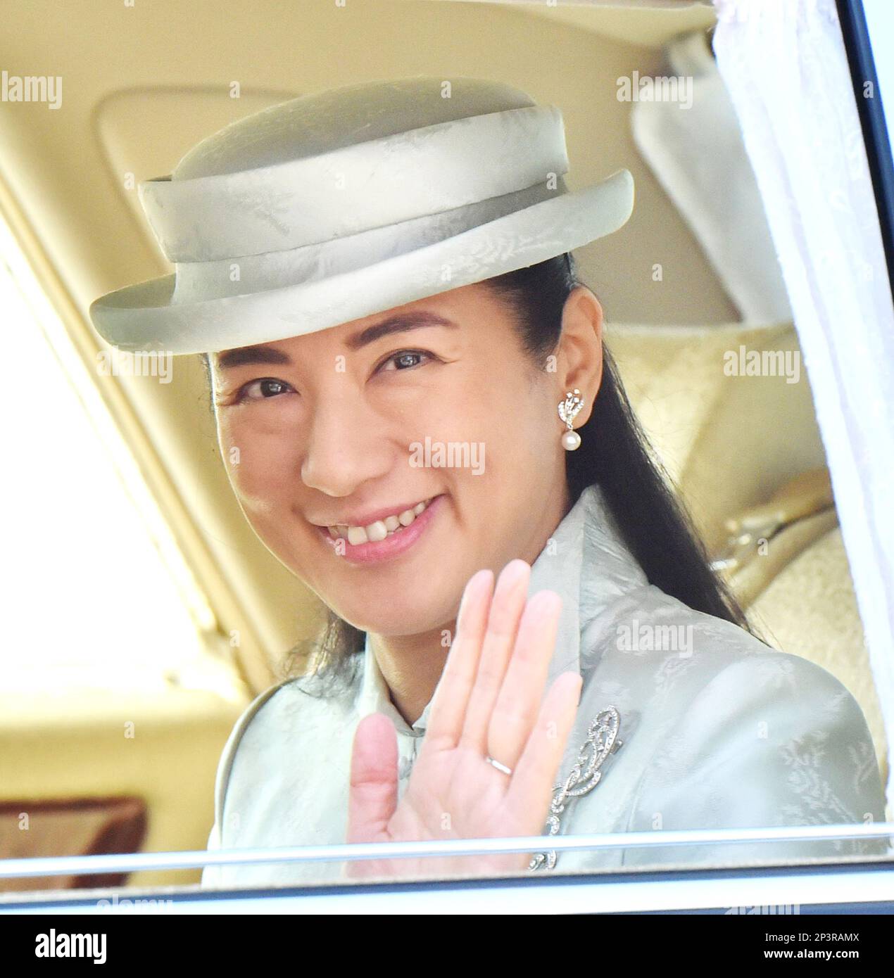 Japanese Crown Princess Masako waves her hand to well-wishers as she ...