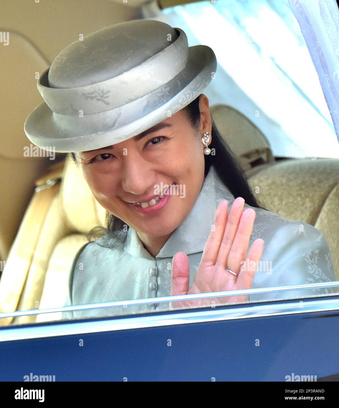 Japanese Crown Princess Masako waves her hand to well-wishers as she ...
