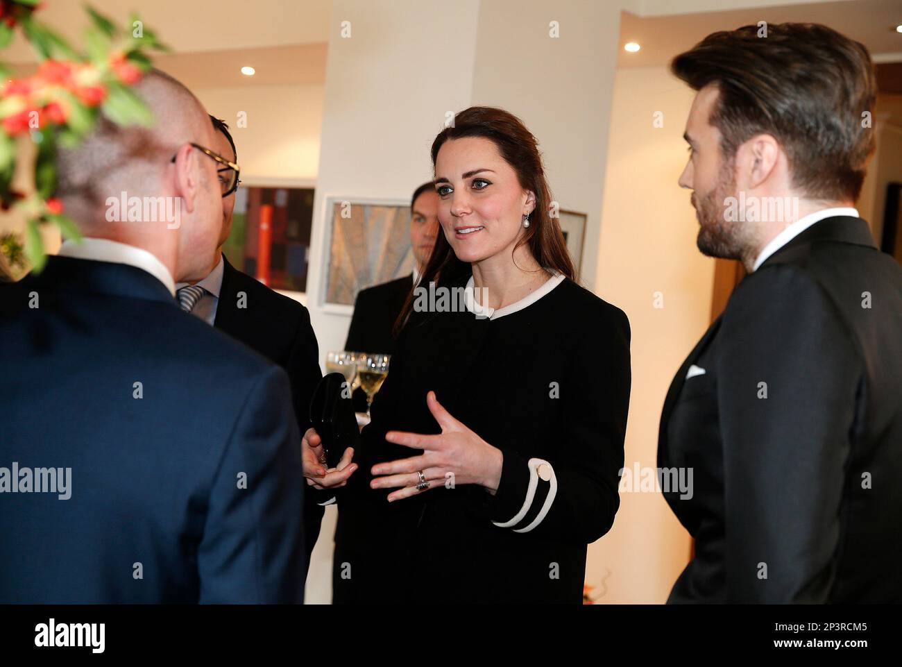 Britain's Kate, Duchess of Cambridge chats with members of the British ...