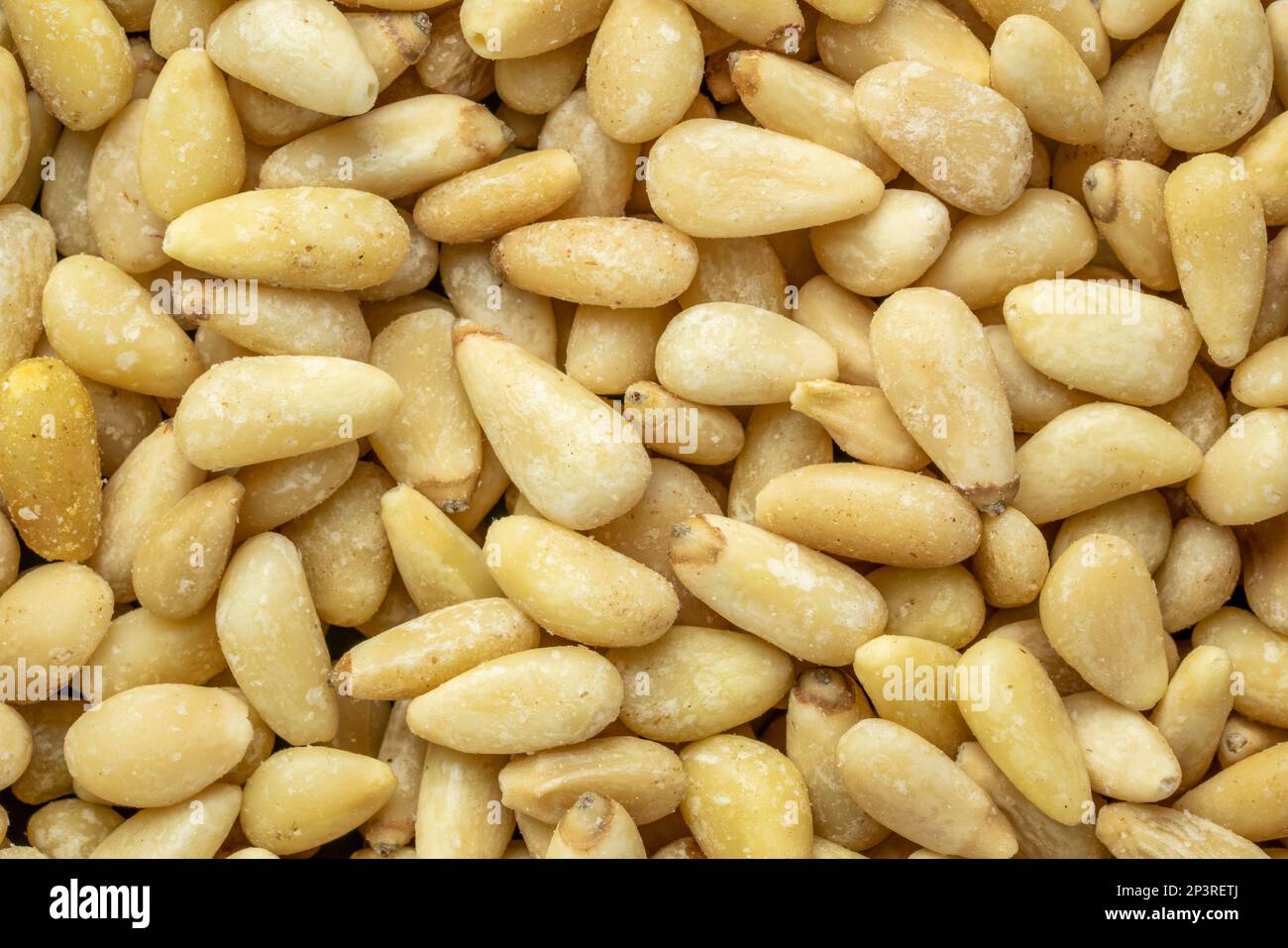 closeup background of shelled pine nuts, top view Stock Photo - Alamy