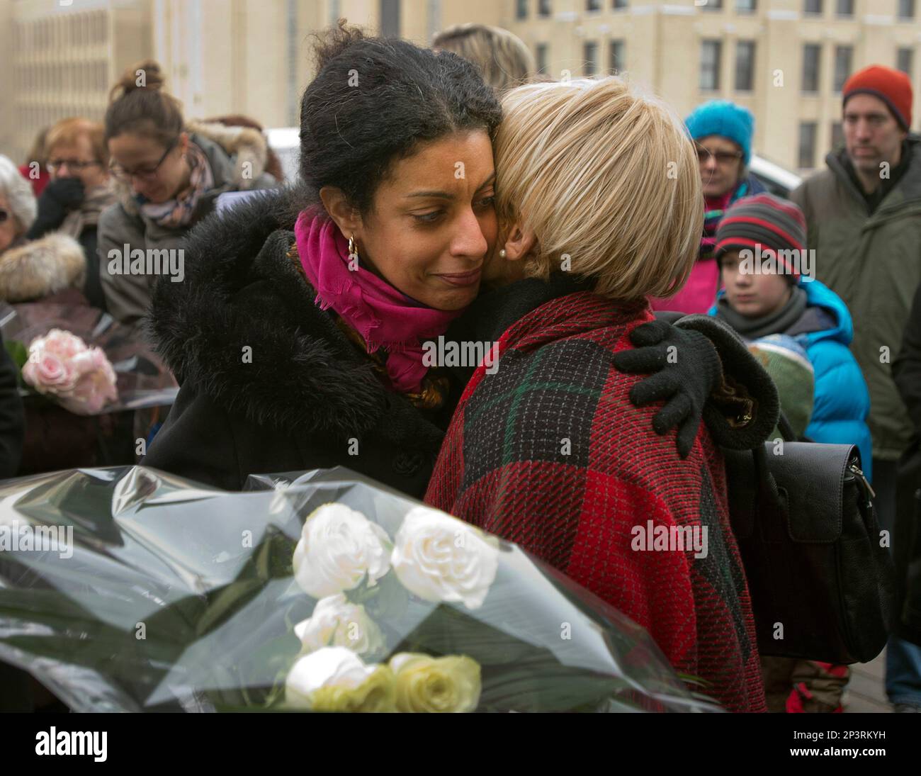 Dominique Anglade, left, is comforted by Michele Thibodeau DeGuire ...