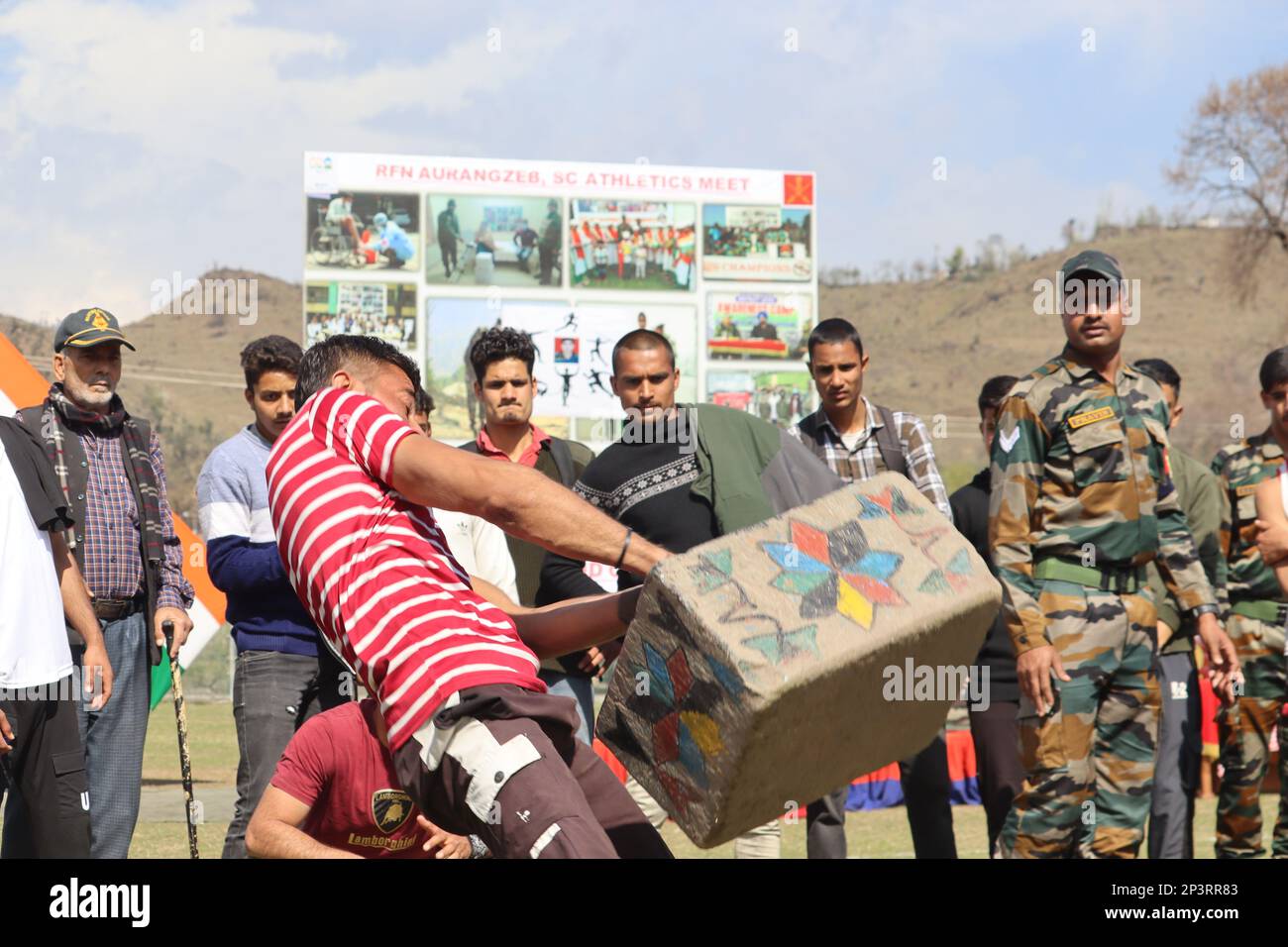 March 5, 2023, Poonch, Jammu and Kashmir, India: A participant lifts a ...