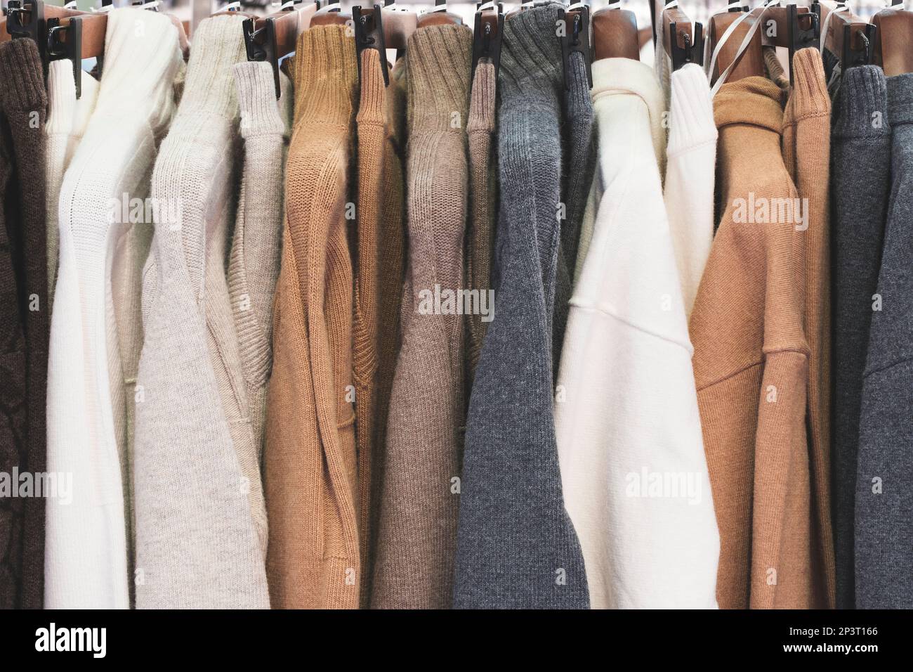 Fashion clothes on clothing rack Closeup of rainbow color choice female ...