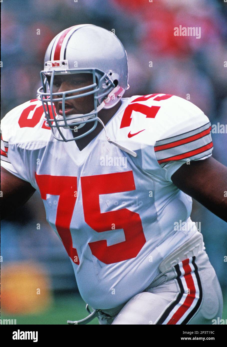 Offensive lineman Orlando Pace (75) of the Ohio State Buckeyes blocks in 1996. (AP Photo / Al ...