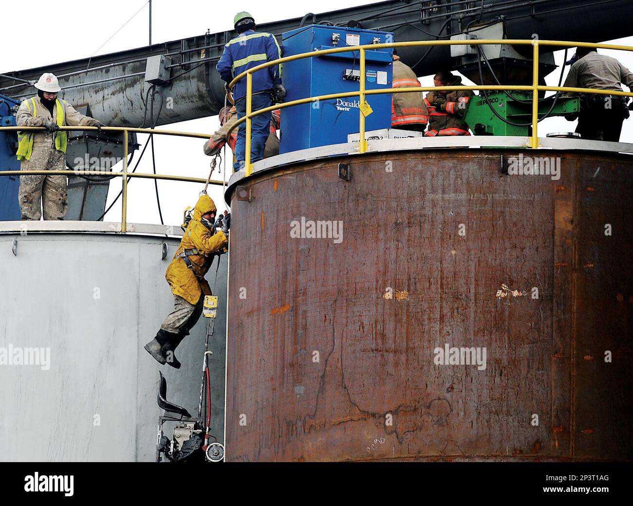 Enid firefighters pull a man to safety after he was trapped 90 feet ...