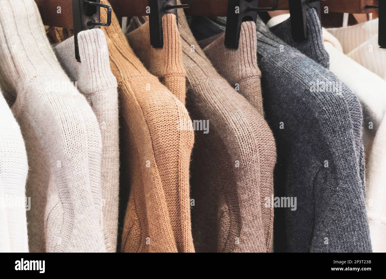 Fashion clothes on clothing rack Closeup of rainbow color choice female ...