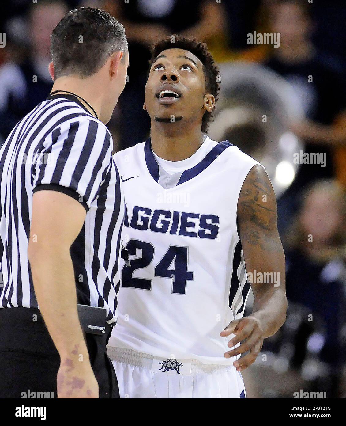 Utah State guard JoJo McGlaston ignores a referee who is talking to him ...