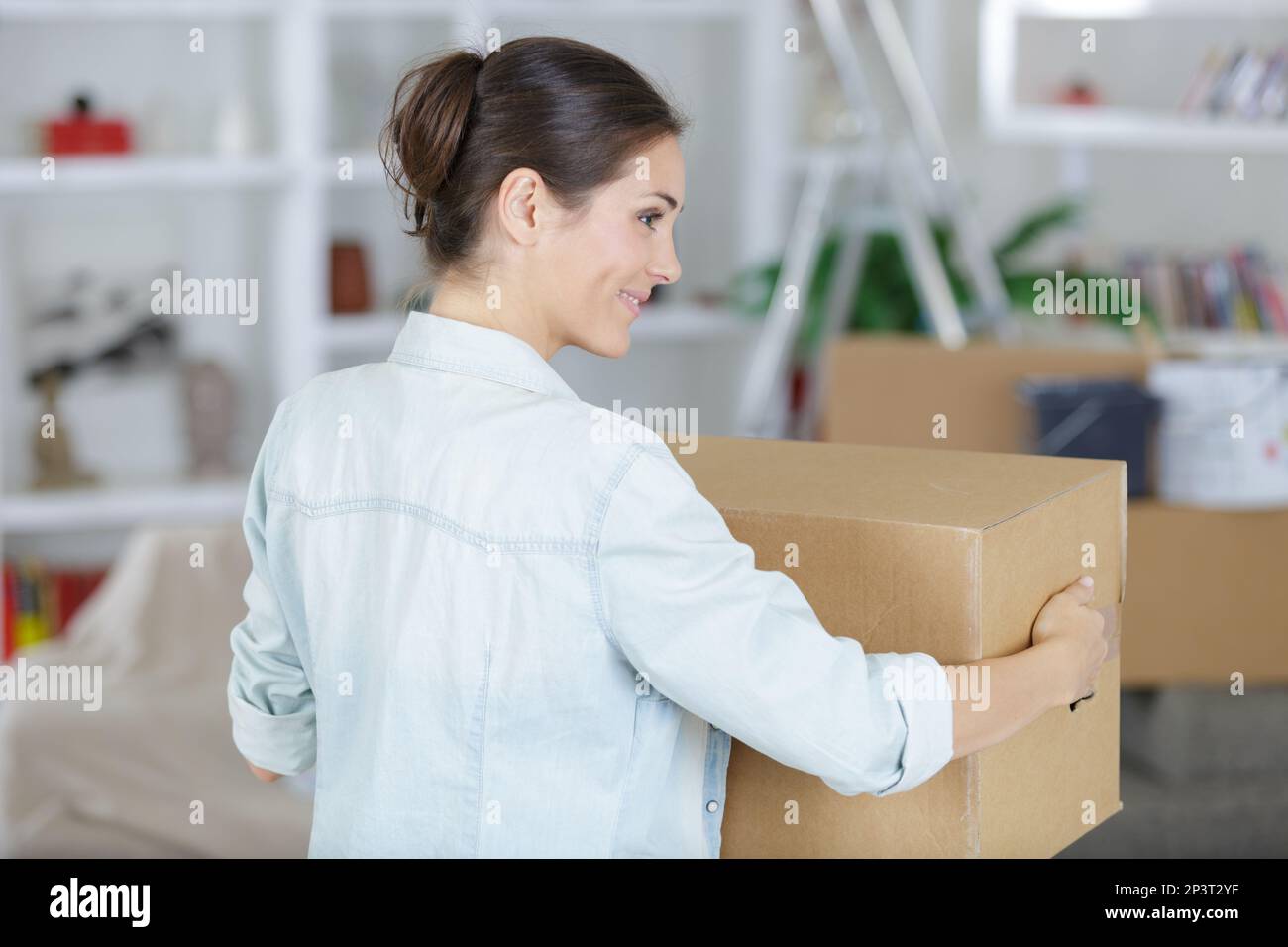 Obscured man carrying boxes hi-res stock photography and images - Alamy