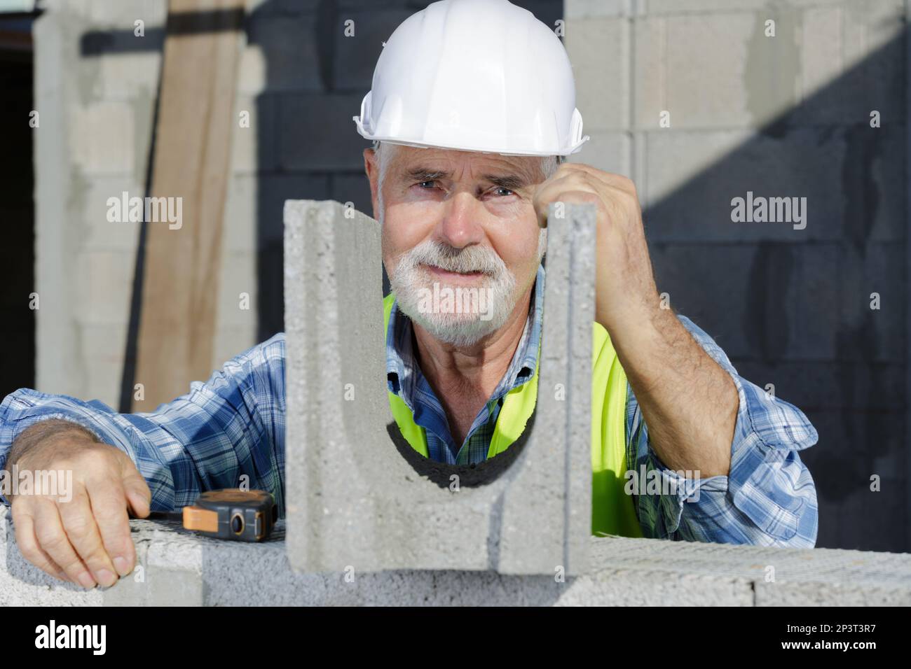 Male worker putting cement in hi-res stock photography and images - Alamy