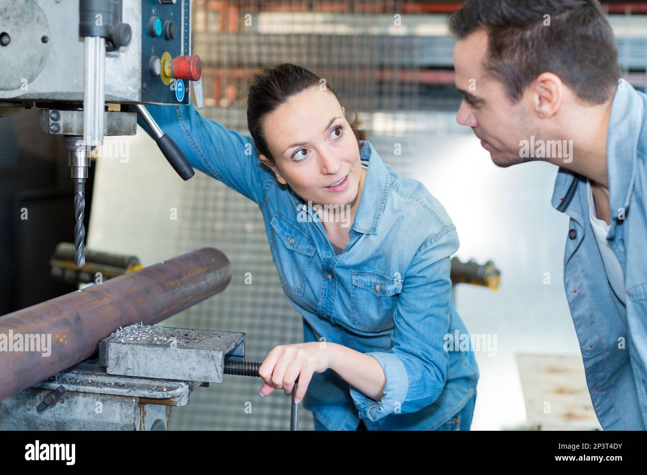 engineer training apprentices on cnc machine Stock Photo - Alamy