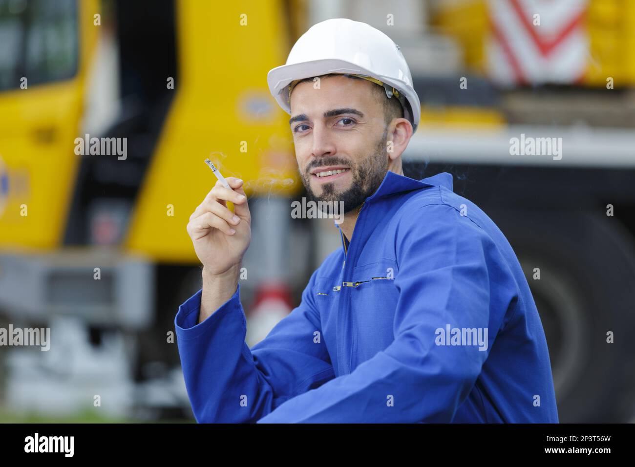 Manual worker smoking cigarette hi-res stock photography and images - Alamy