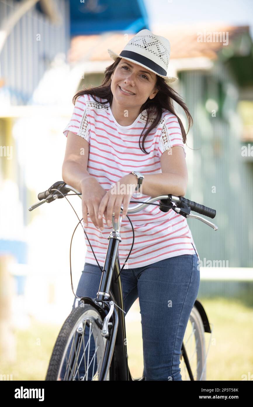 Lovely woman on bike hi-res stock photography and images - Alamy