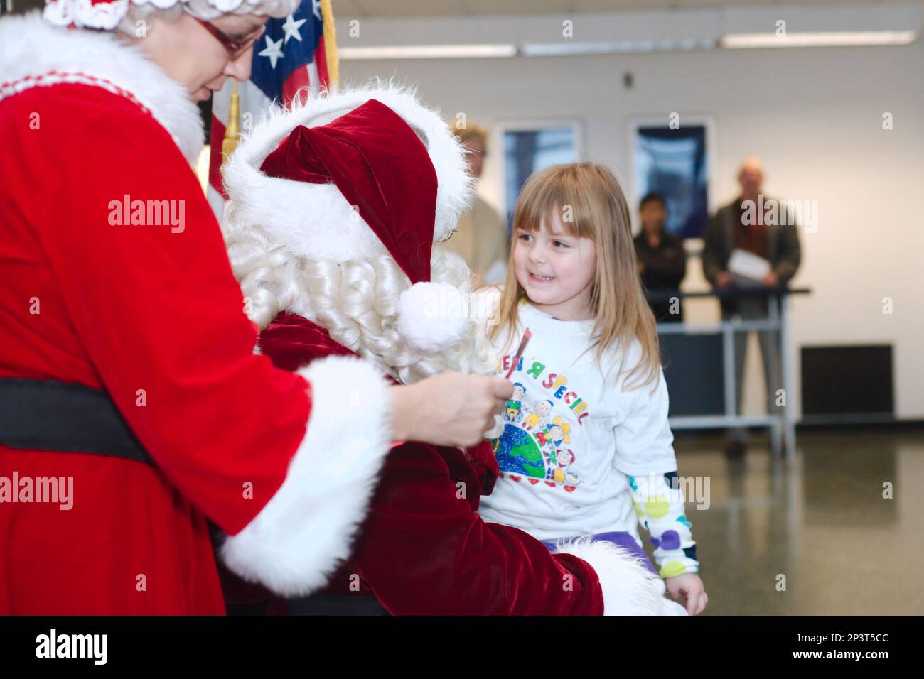 Four-year-old Riley Reeves from Children's University talks to Santa as ...