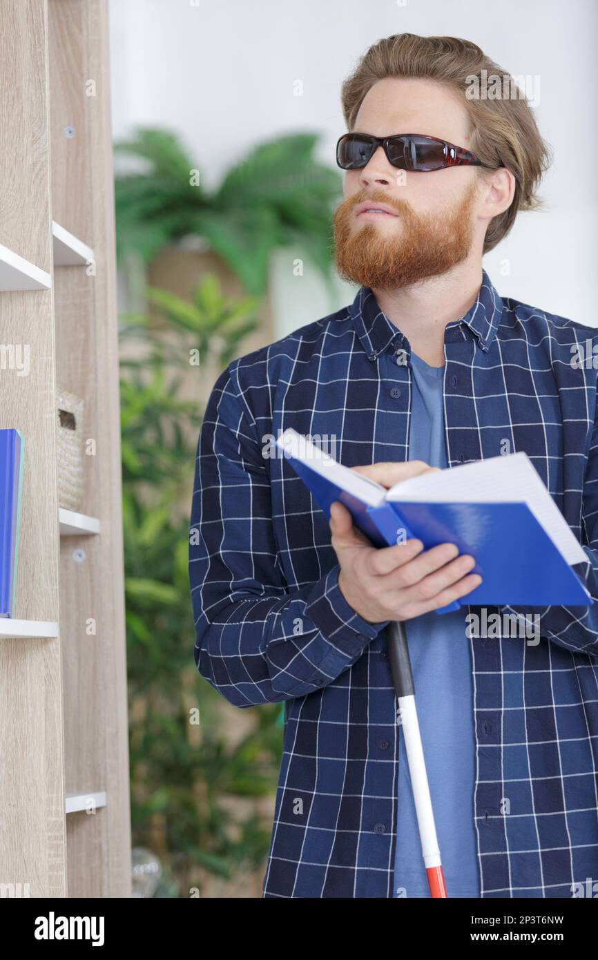 blind man reading book written in braille at home Stock Photo - Alamy