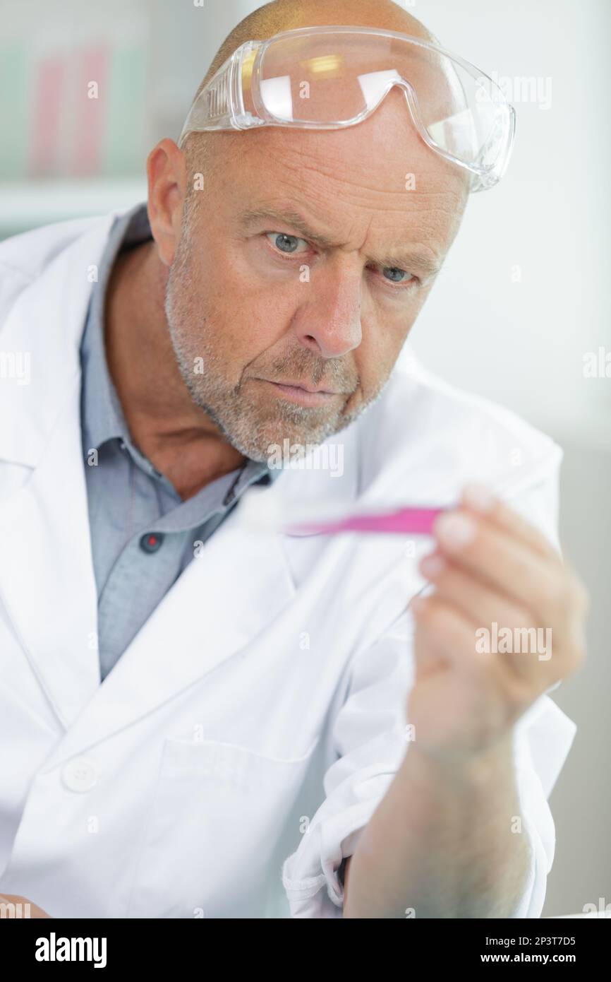 Doctor working biochemistry analyzer in hi-res stock photography and ...