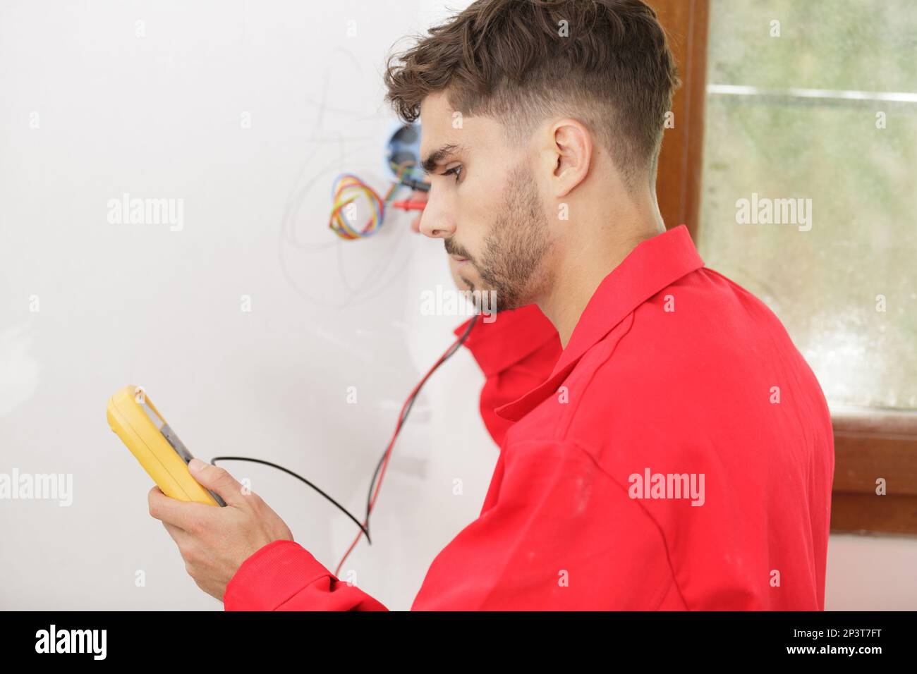 electrical student checks phase rottation for high voltage cable Stock ...