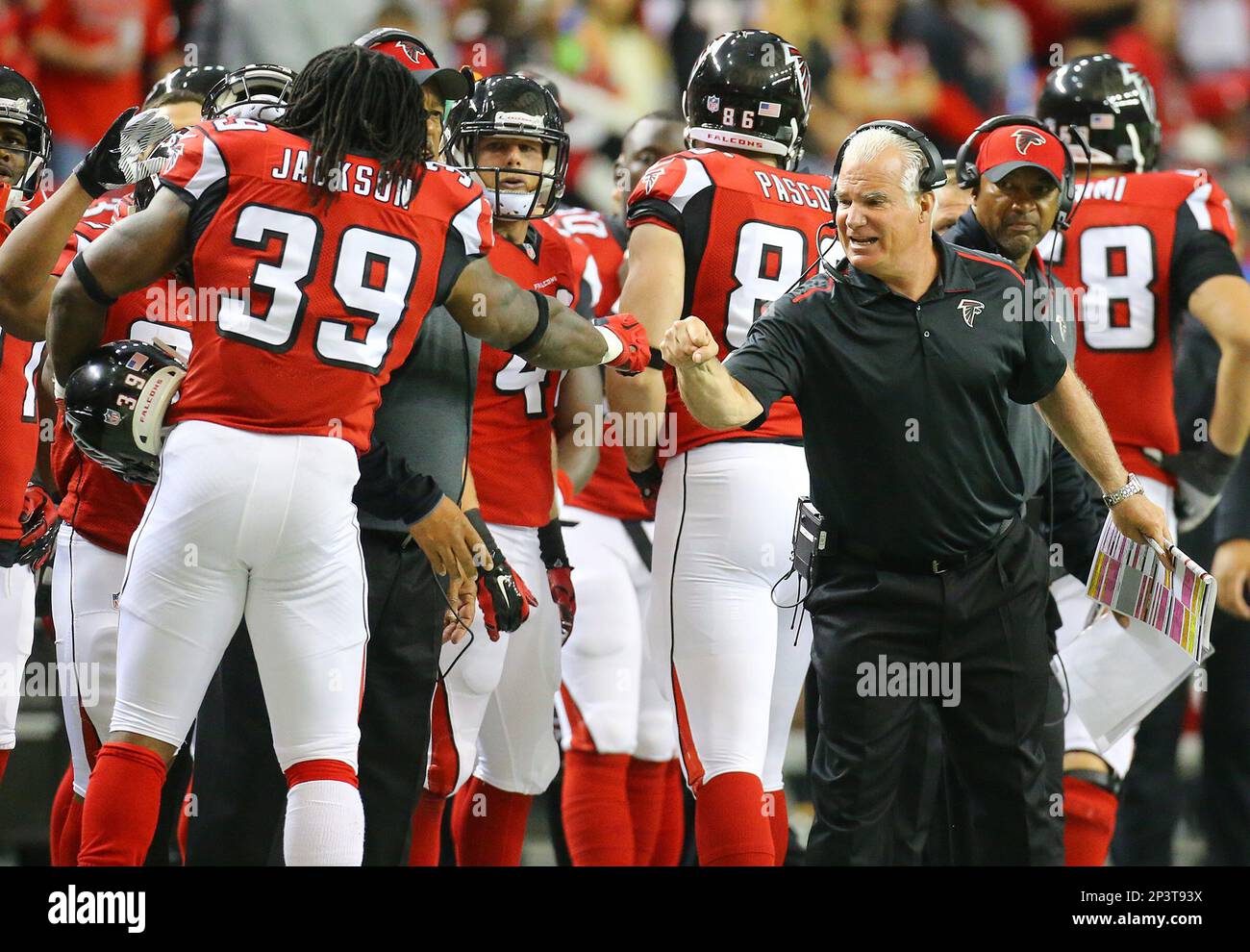 Falcons head coach Mike Smith gives running back Steven Jackson a fist ...