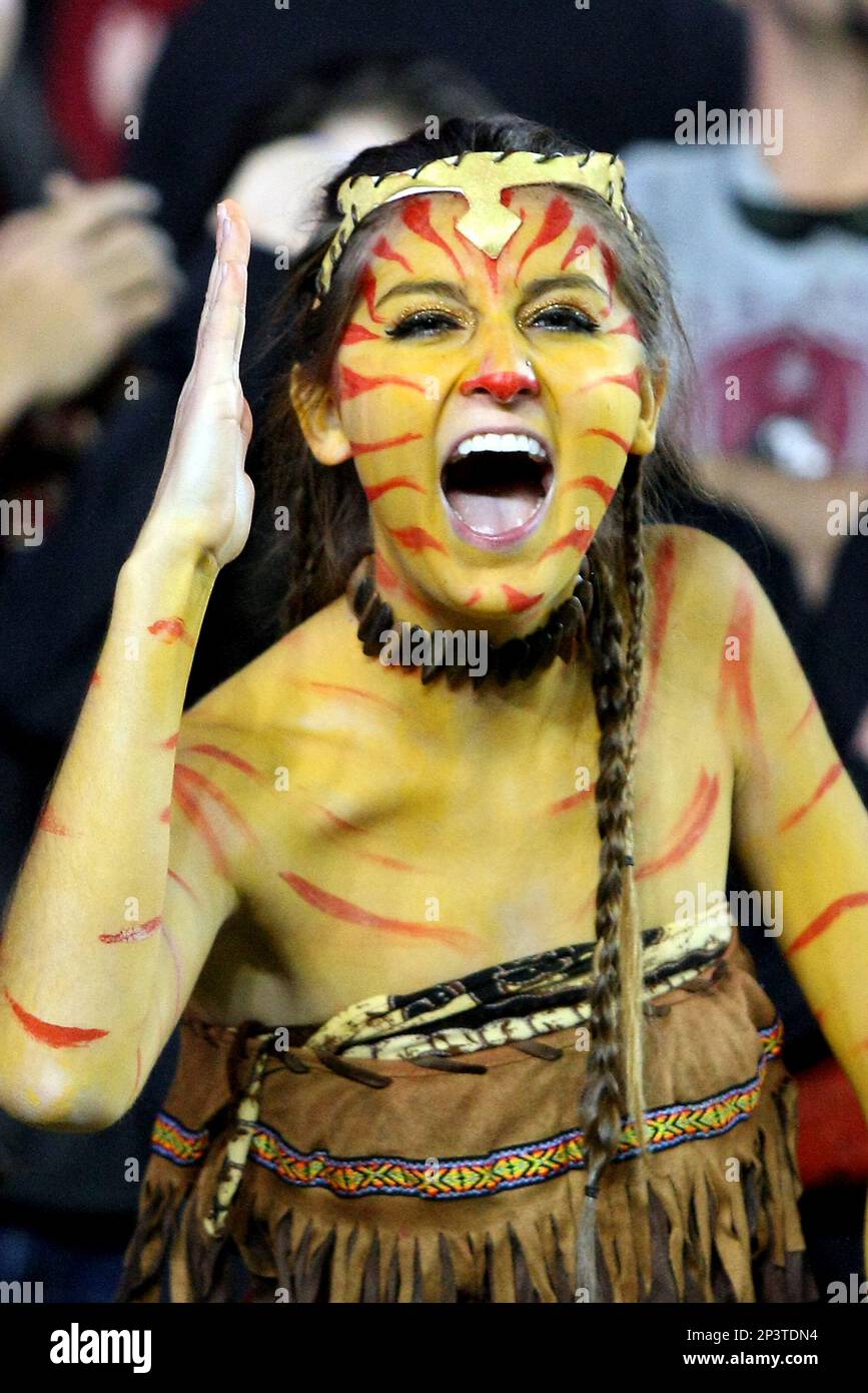 A FSU fan does the tomahawk chop during an NCAA football game between ...