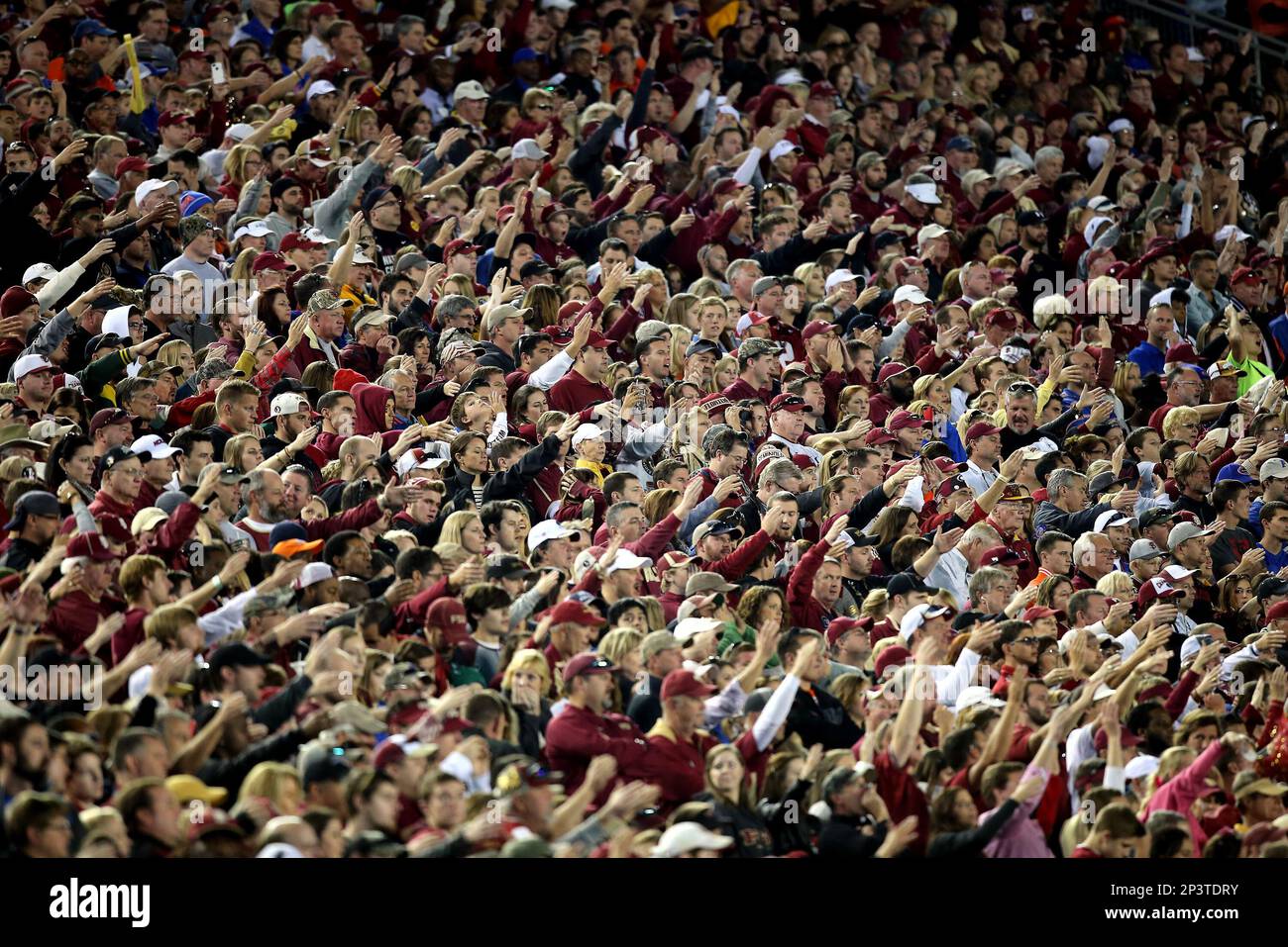 Florida State fans perform the tomahawk chop during an NCAA football ...